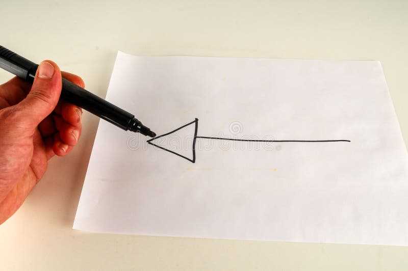 Close-up of Sheet with Drawing Arrow Stock Photo - Image of arrow ...