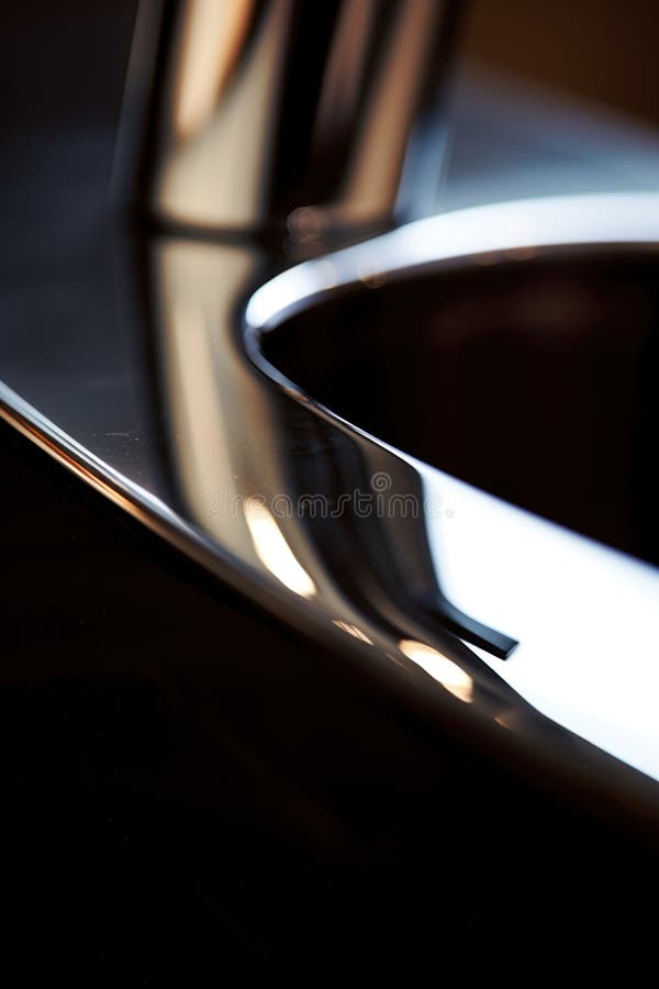 A Close Up of a Shiny Metal Sink with the Reflection, AI Stock ...