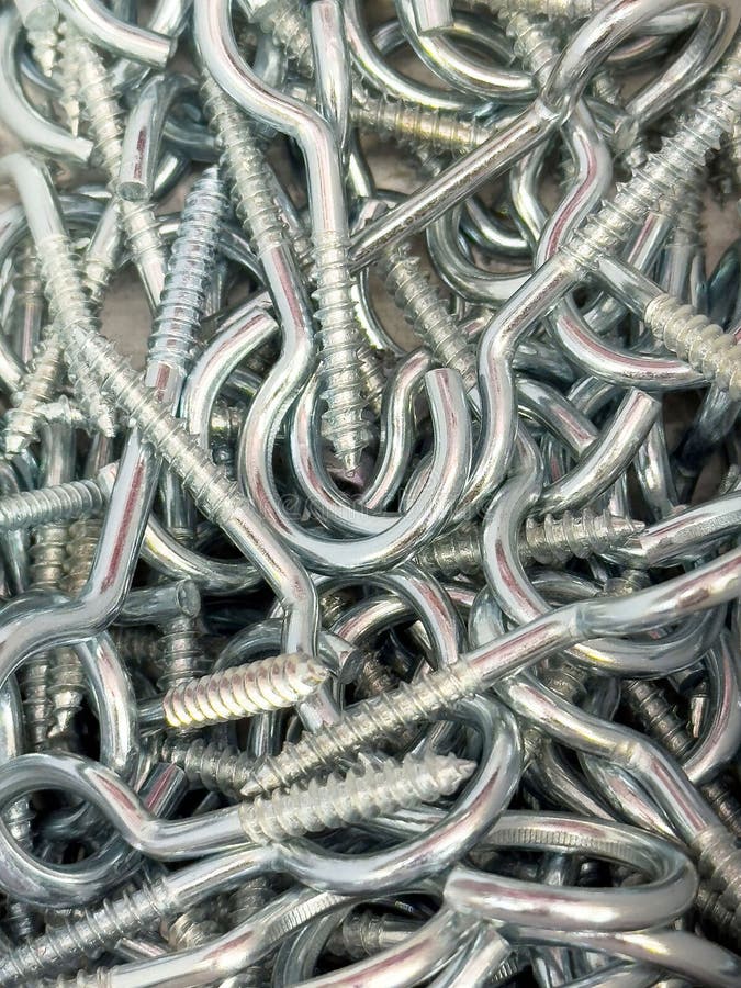 Close-up of Shiny Metallic Hooks and Screws in a Pile Stock Image ...