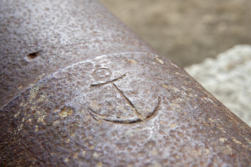 Close-up of a Ship S Anchor Drawing on a Rusty Cannon Stock Photo ...