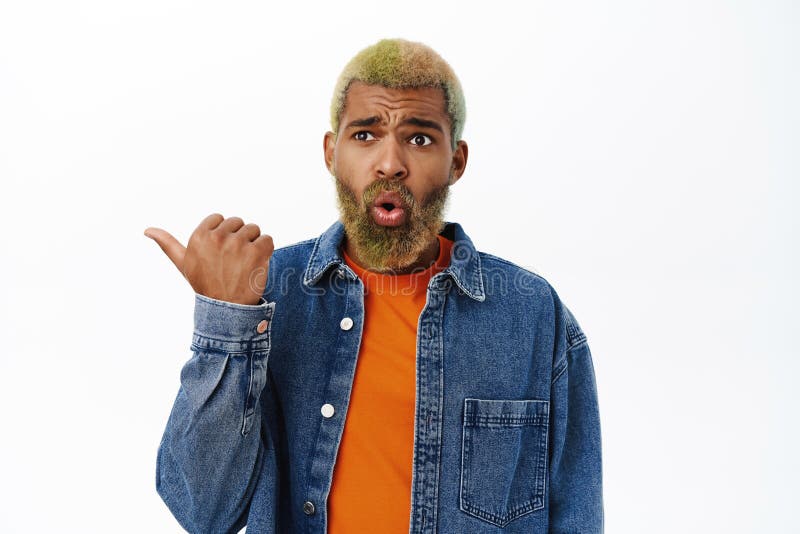 Close Up of Shocked Black Man Pointing Left, Looking Concerned and ...