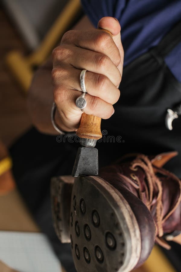 Close Up of Shoe Maker Hands Producing Boots in His Leather Workshop ...