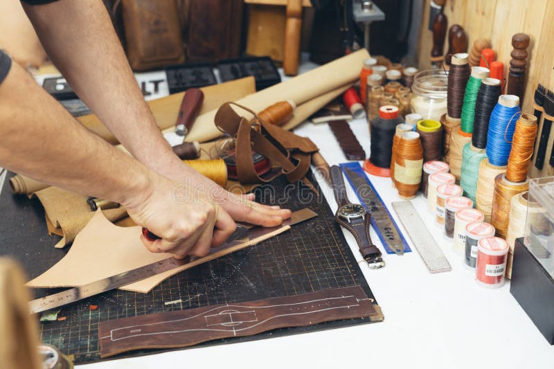 Close Up of a Shoemaker or Artisan Worker Hands. Leather Craft Tools on ...