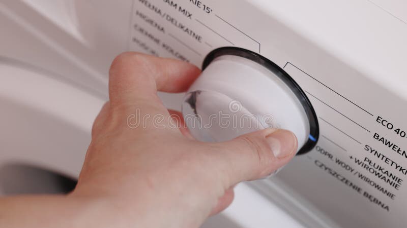 Close Up Shooting with a Hand Rotating the Front Panel Button ...