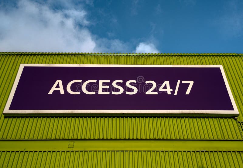 Close-up Shot of an Access 24 7 Sign on a Green Metallic Wall Stock ...