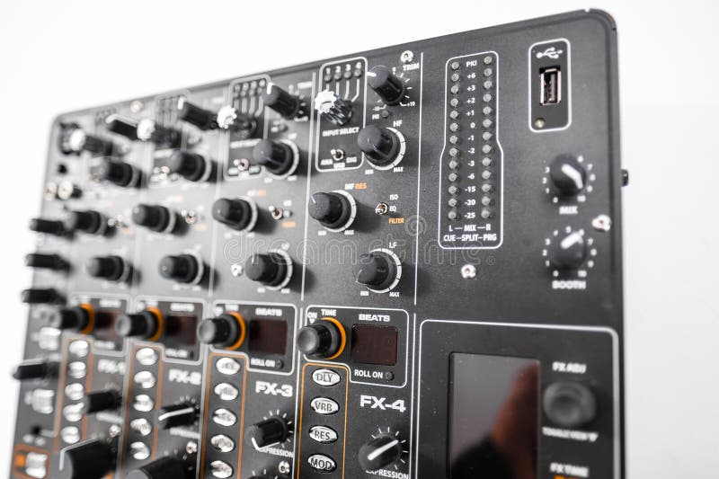 Close-Up Shot of an Audio Mixer with Various Control Knobs and Settings ...