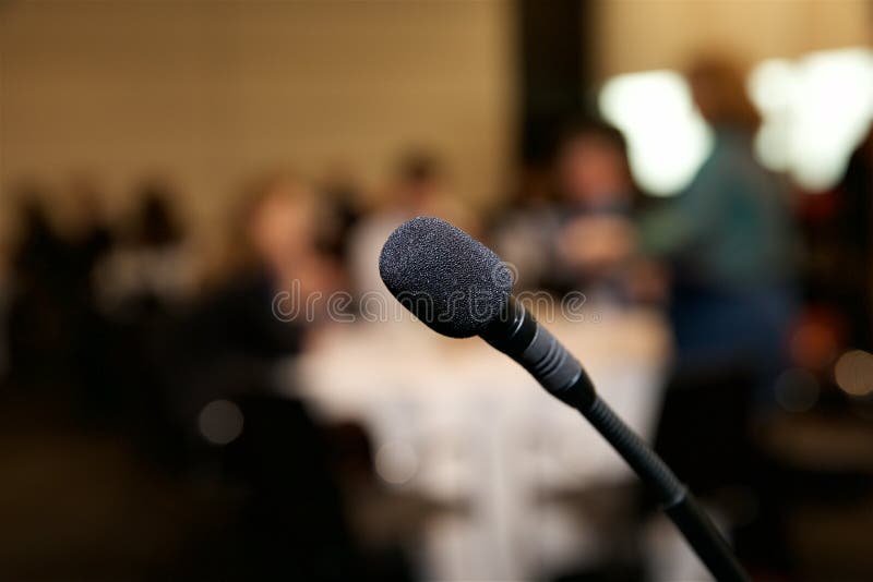 Microphone with Defocused Audience in the Background. Stock Image ...