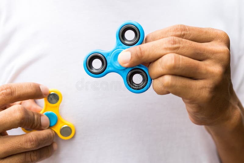 Close-up Shot of a Blue Spinner. Stock Photo - Image of relaxing, hand ...