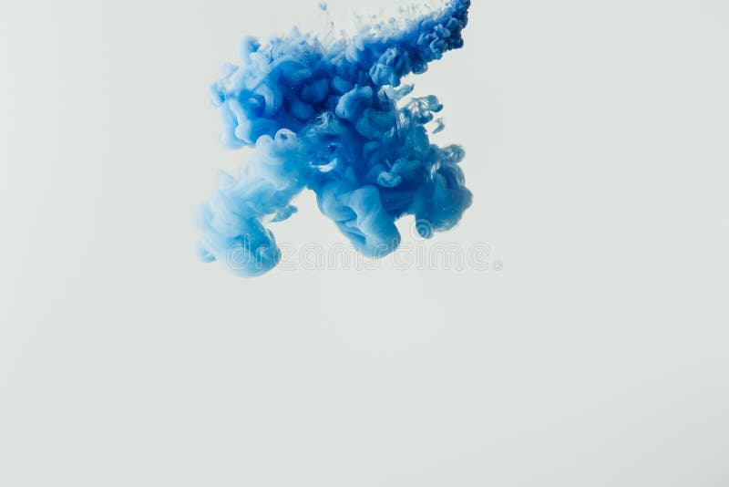 Close Up Shot of Bright Blue Paint Splash in Water Isolated on Gray ...