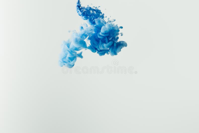Close Up Shot of Bright Blue Paint Splash in Water Isolated on Gray ...