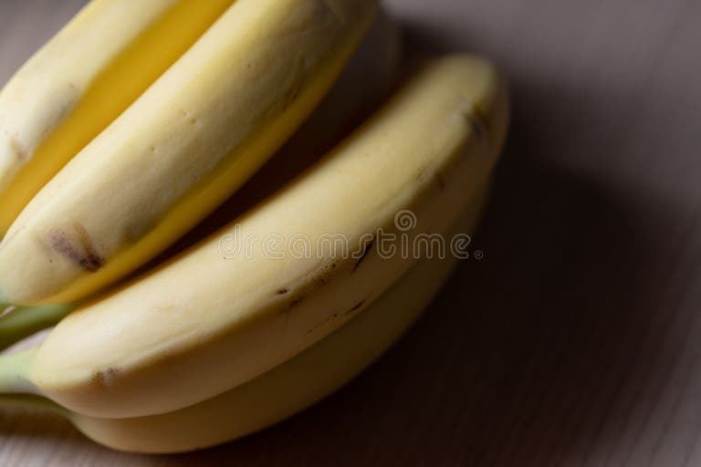 Close-up Shot of a Bundle of Bananas on a Table Stock Image - Image of ...