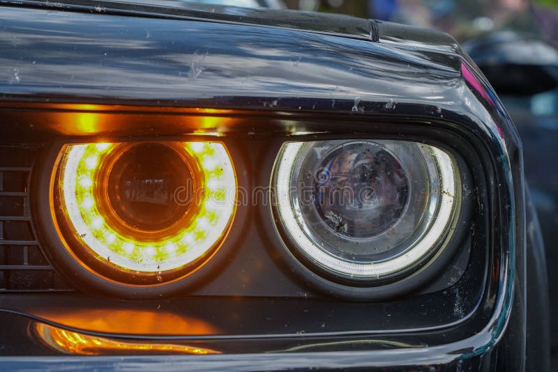 Close-up Shot of a Car Headlight Illuminating with a Bright Light ...