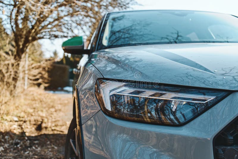 Car Headlight and Side View with Tree Reflections Stock Photo - Image ...