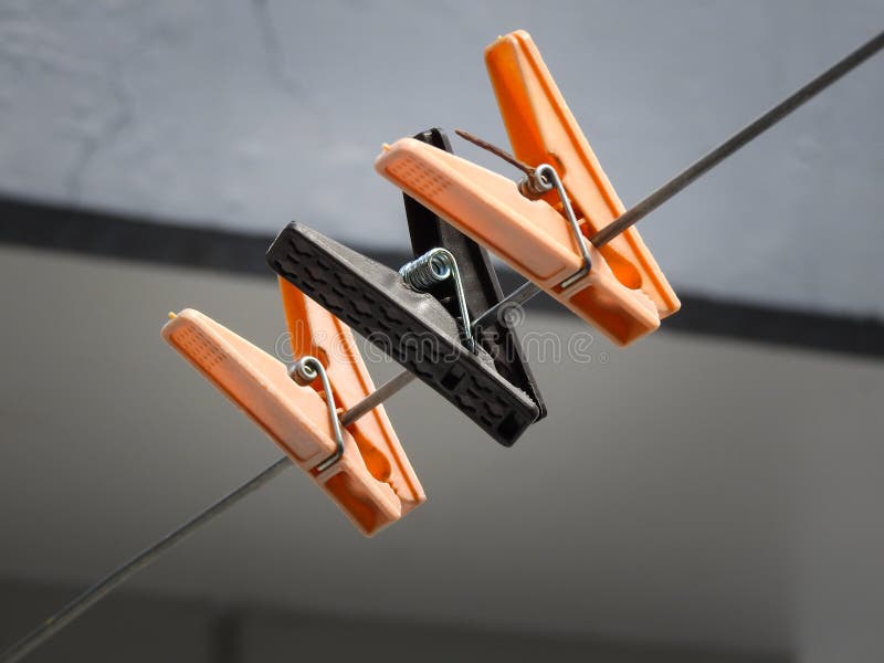 A Close Up Shot of Cloth Clipper on a Steel Wire Stock Image - Image of ...