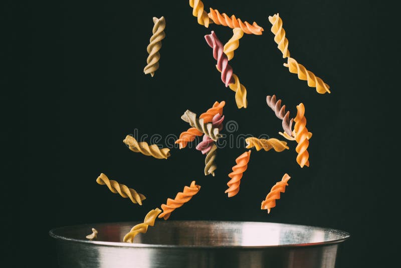 Close Up Shot of Colorful Fusilli Falling into Pan Stock Image - Image ...