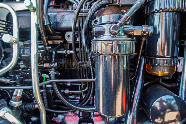 A Close Up Shot of a Complex Tractor Engine with Various Pipes and ...