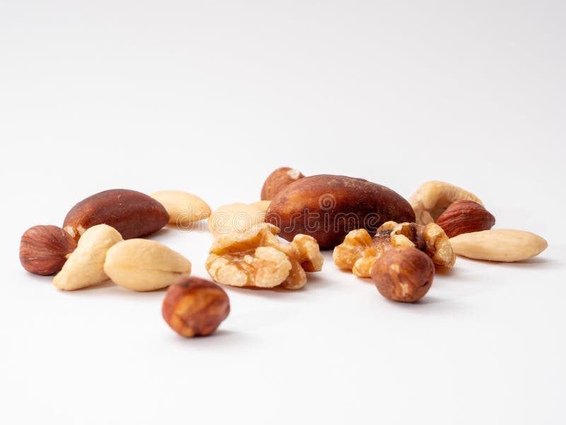 Close-up Shot of Different Kinds of Nuts on a White Surface. Stock ...