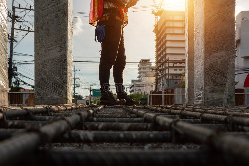 Close Up Shot Engineer Standing at a Construction Site during Su Stock ...