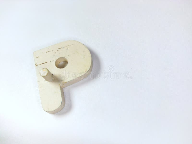 An Off-white Wooden Object in the Shape of the Letter P, Isolated on ...