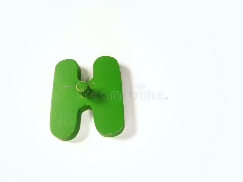 A Vibrant Green Wooden Object in the Shape of the Letter H, Isolated on ...