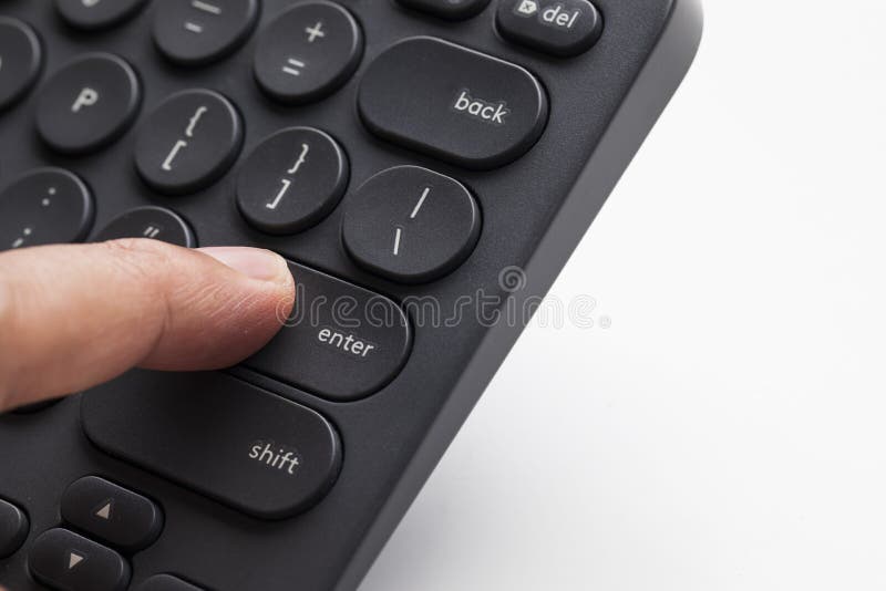 Finger pressing enter key stock photo. Image of hand - 125729784