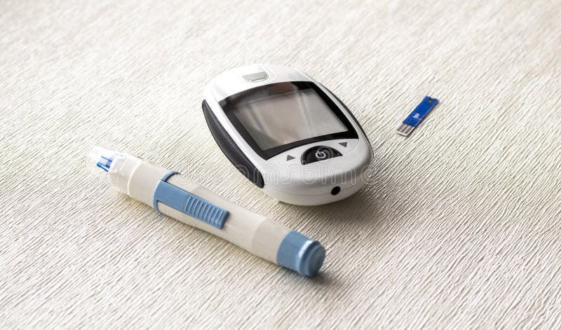 Close Up Shot of the Glucometer Instrument on the White Surface ...