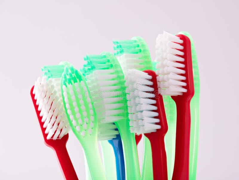 Close Up Shot of a Group of Toothbrushes Isolated on White Background ...