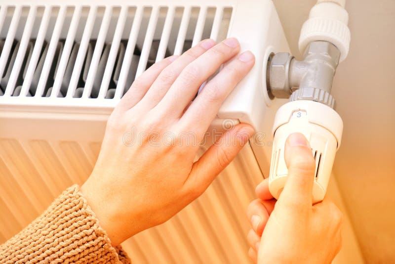 Hands Checking the Temperature of a Heating Radiator Stock Image ...