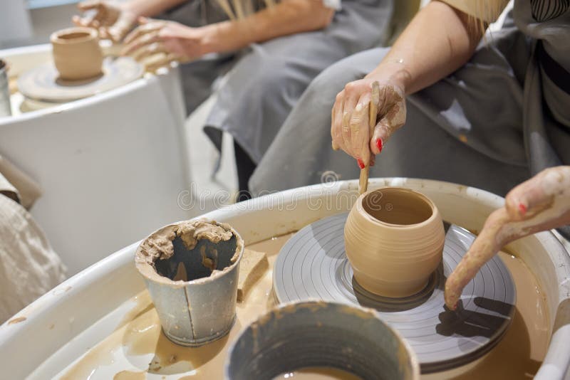 Close Up Shot of Hands of Crafts People, Working with Clay in Pottery ...