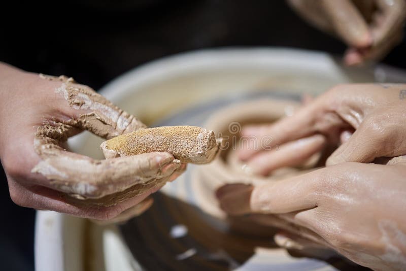 Close Up Shot of Hands of Crafts People, Working with Clay in Pottery ...