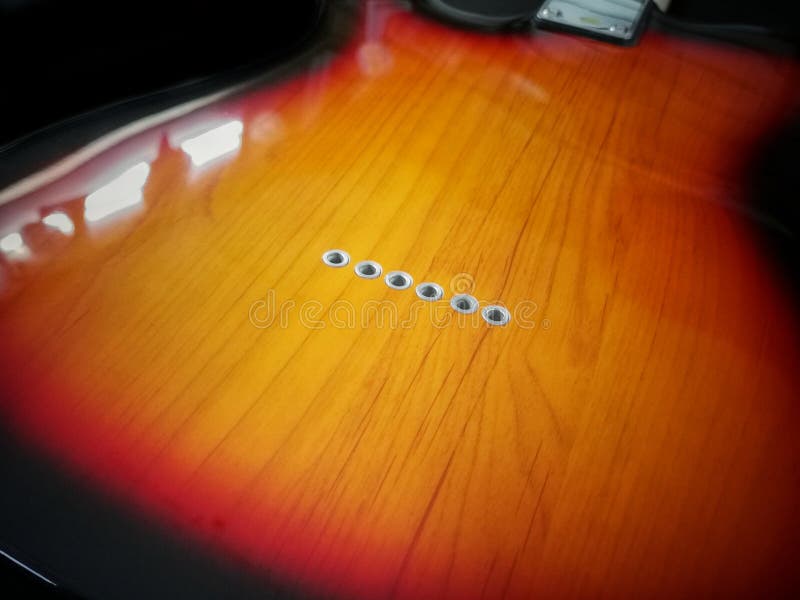 Close Up Shot of Holes for String in Eletronic Back Side of Guitar Body ...