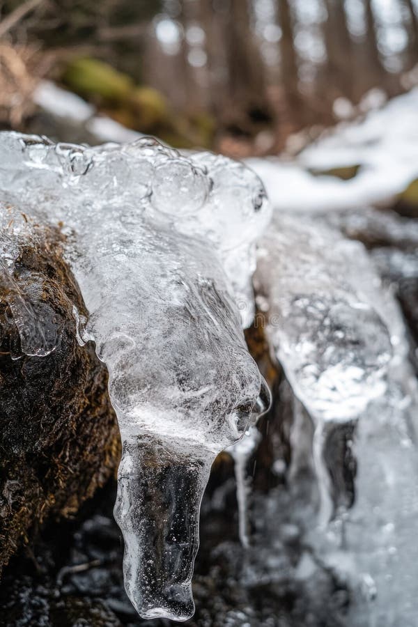 A Close-up Shot of Ice Formed on a Rock, Highlighting the Texture and ...