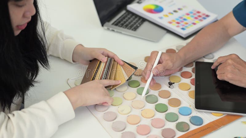 Close Up Shot of Interior Designer Giving Advice To Client Selecting ...