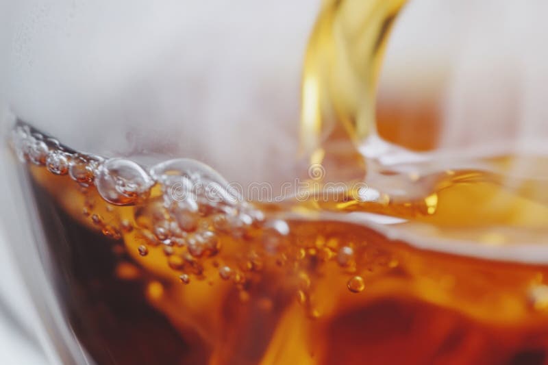 A Close-up Shot of a Liquid Being Poured into a Glass Stock Image ...