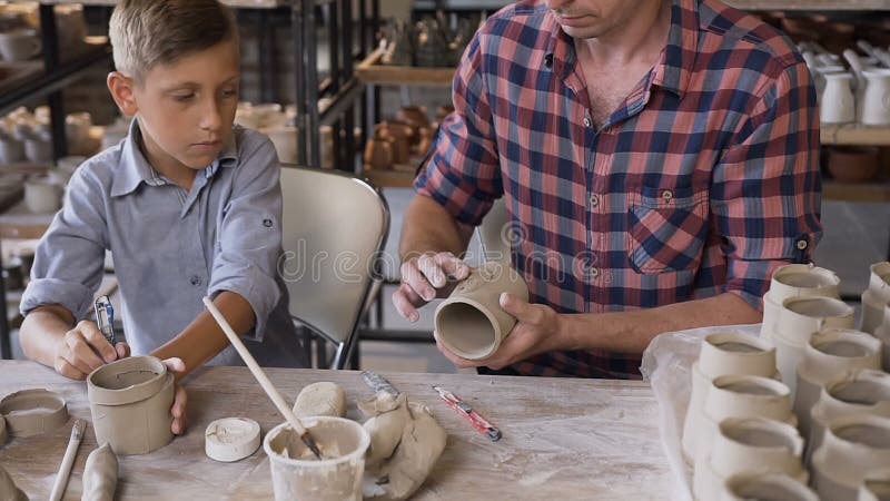 Little Cute Boy with His Father Making Ceramic Pots in the Pottery ...