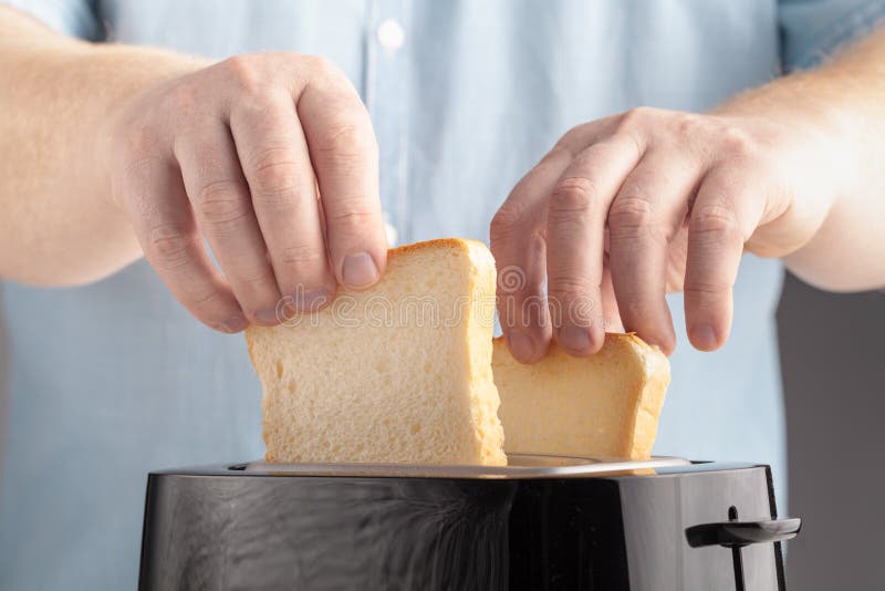 Close-up Shot of Man Taking Toast from Toaster Stock Image - Image of ...