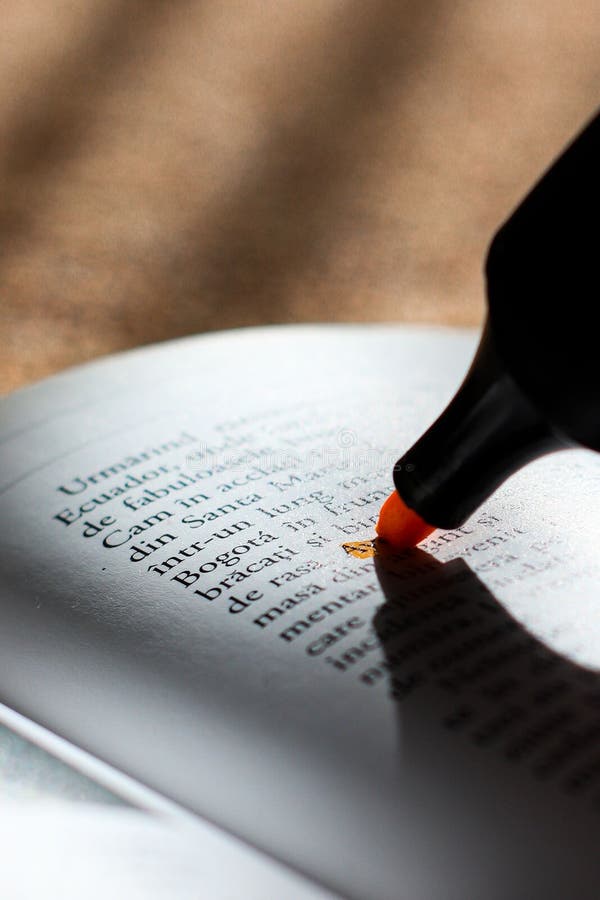 Close-up Shot of a Marker Highlighting a Line in a Book Stock Image ...