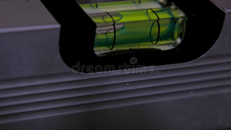 Close-up Shot Measuring the Inclination of the Plane with the Spirit ...