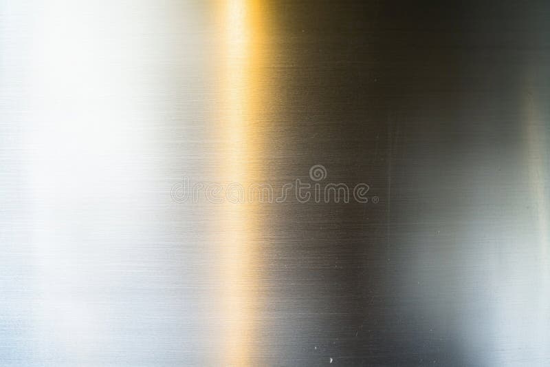 A Close-up Shot of a Metal Plate Lit by a Light Source, Highlighting ...