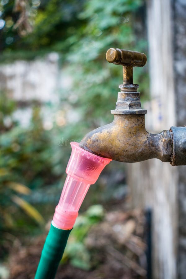 A Close Up Shot of Metal Tap with a Hose on Stock Image - Image of ...