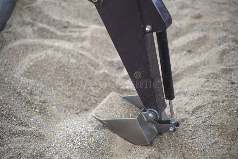 Mini Excavator Lifting Some and with Its Cup Stock Photo - Image of ...