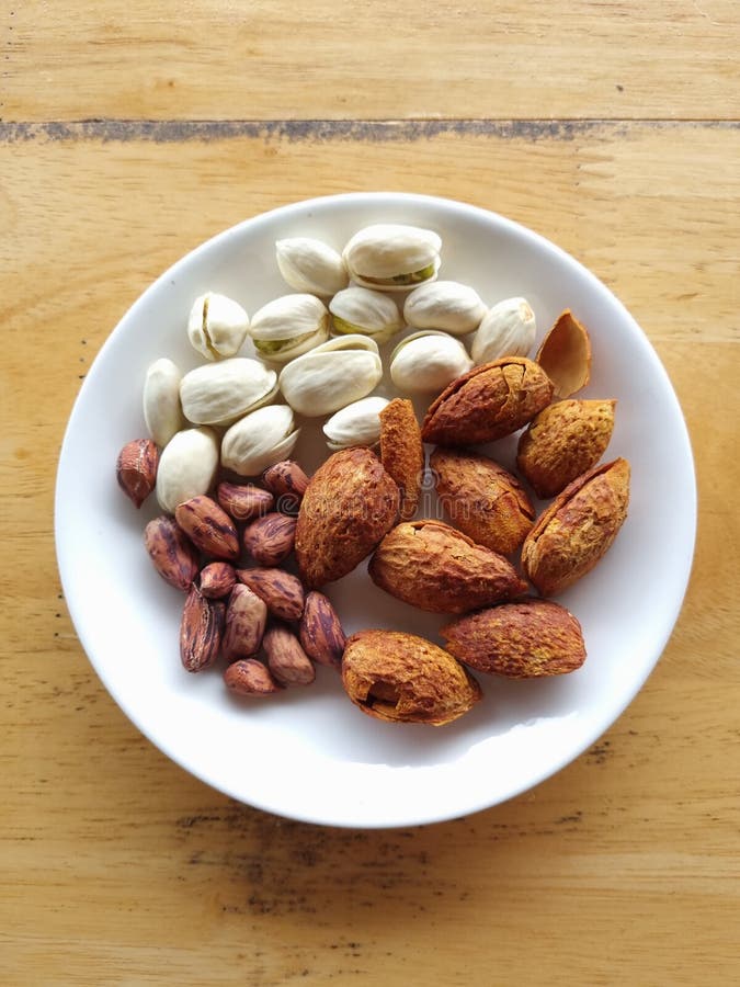 Close-up Shot of Nuts Served on Plate Stock Photo - Image of pistachio ...