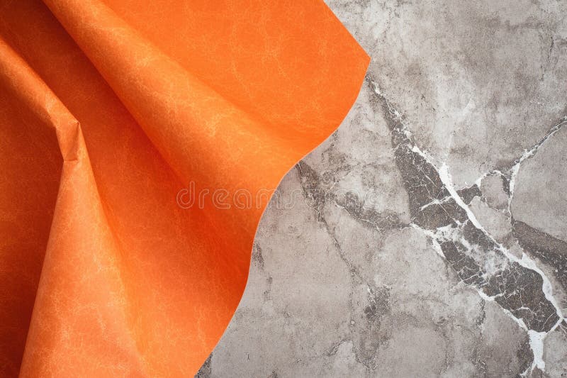 Close-up Shot of Orange Fabric on a White Marble Surface Stock Image ...