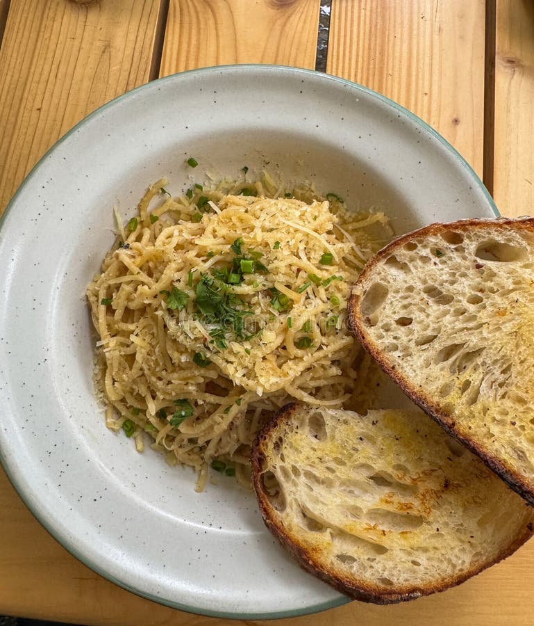 A Plate of Spaghetti Aglio Olio with Garlic Bread Stock Photo - Image ...