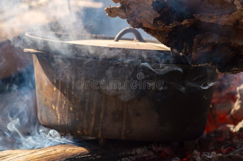 A Close-Up Shot of Pot on a Campfire Surrounded by Smoke Stock Image ...