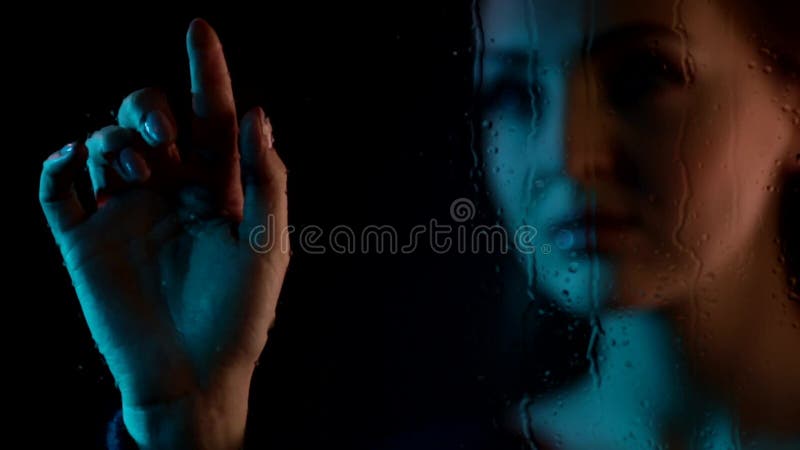 Young Attractive Sad Dreamy Woman Behind Steamy Rain Drop Glass Window