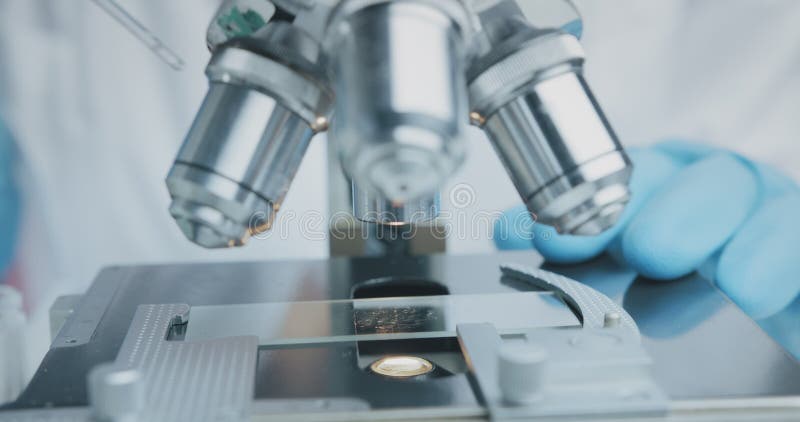 Close Up of Examining of Test Sample of Microchip Transistor Under the ...