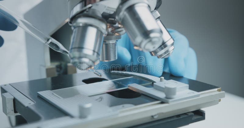 Close Up of Examining of Test Sample of Microchip Transistor Under the ...