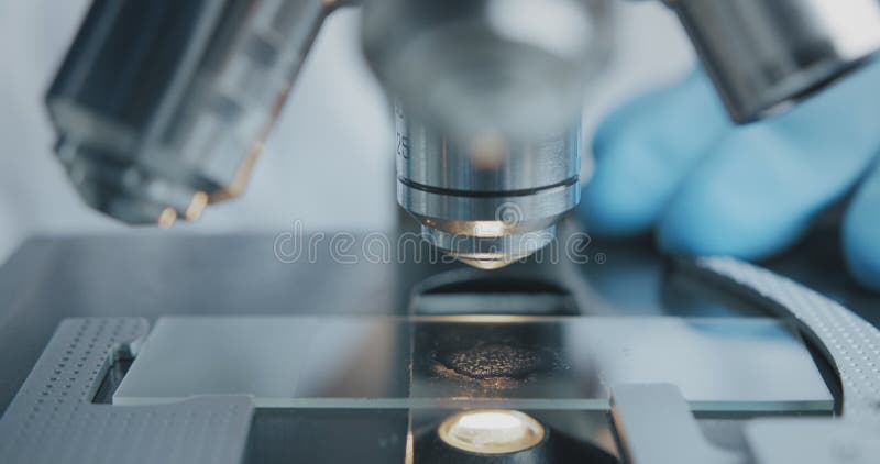 Close Up of Examining of Test Sample of Microchip Transistor Under the ...