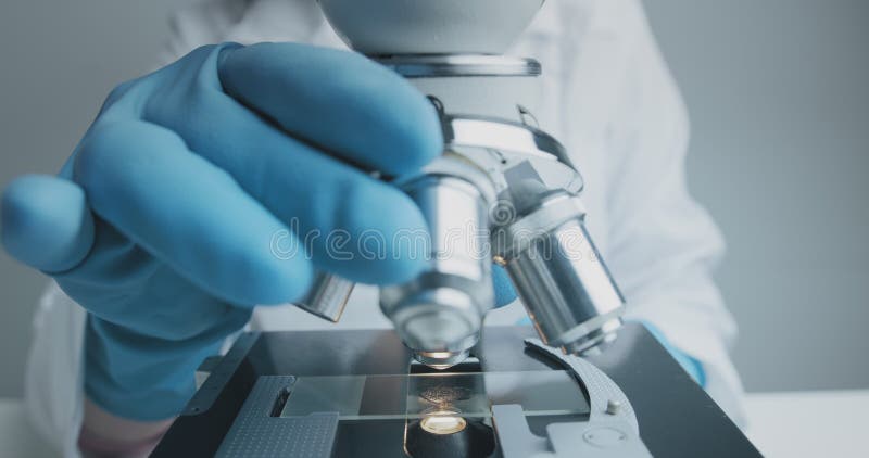 Close Up of Examining of Test Sample of Microchip Transistor Under the ...